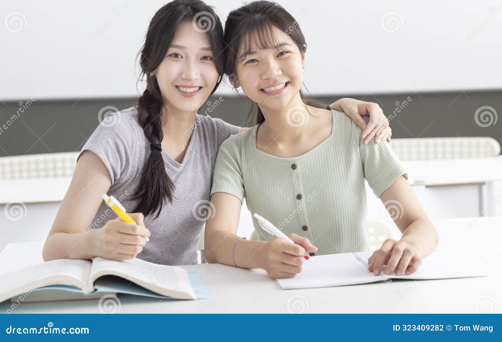 Smiling Teenage Classmates during Lesson in Classroom Stock Photo ...