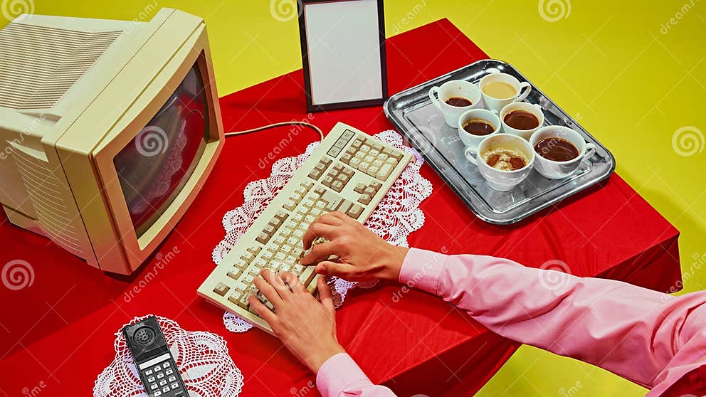 View from Above of Man Typing at Vintage Computer, with Tray of ...