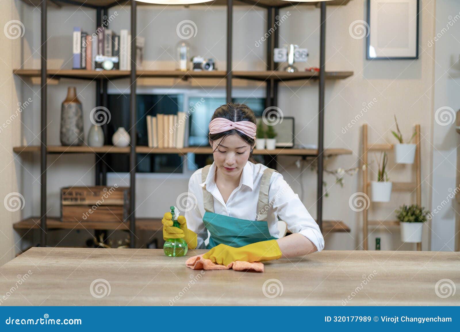 The Young Woman is Wiping Cleaning the Table Stock Image - Image of ...