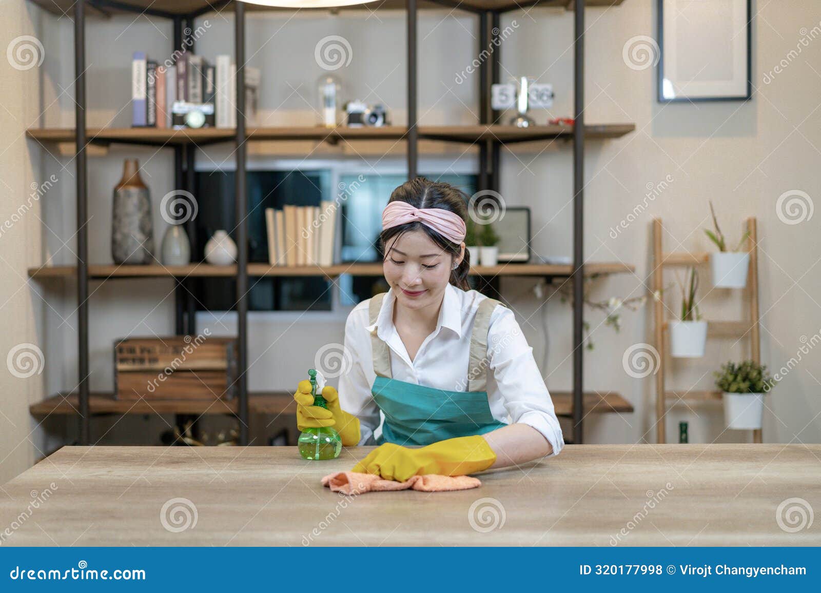The Young Woman is Wiping Cleaning the Table Stock Photo - Image of ...