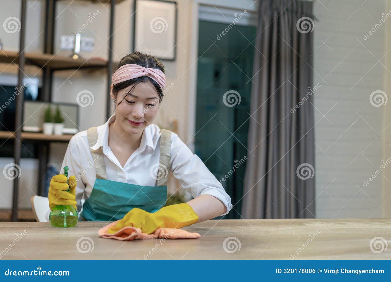 The Young Woman is Wiping Cleaning the Table Stock Photo - Image of ...