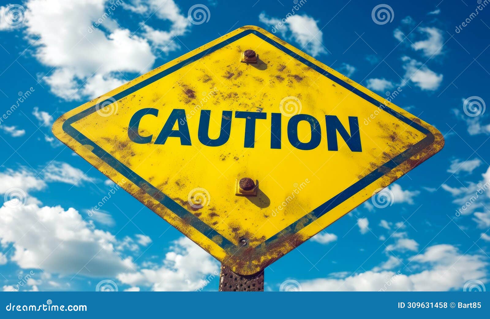Bright Yellow Caution Sign Against a Cloudy Blue Sky Backdrop ...