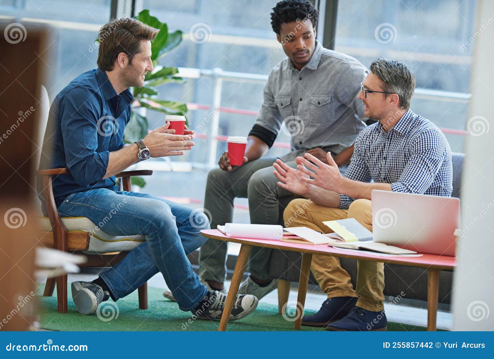 Generating Dynamic Ideas. a Group of Office Workers Talking Together in ...