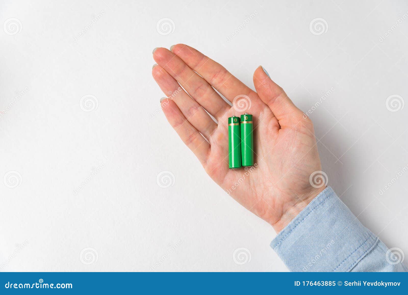 Generic AA Alkaline Batteries on Palm on White Background. Accumulator ...