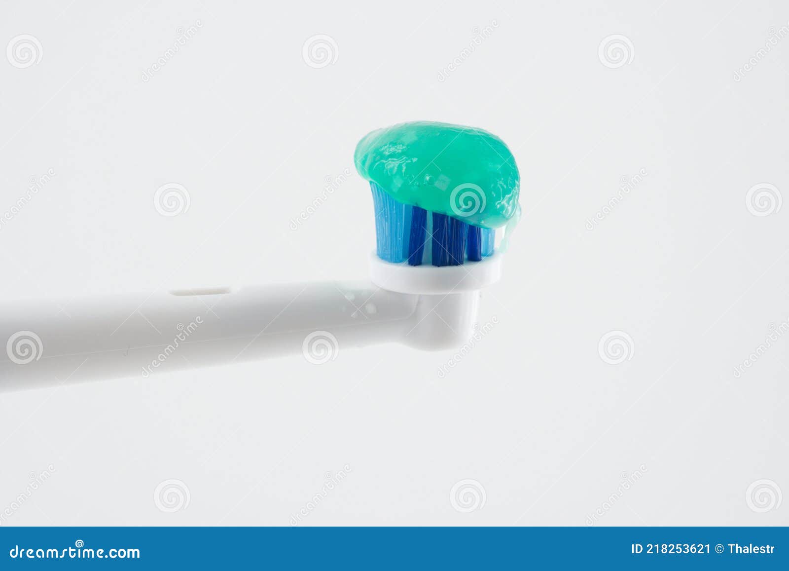 Generic Automatic Toothbrush Head with Green Toothpaste on Blue ...