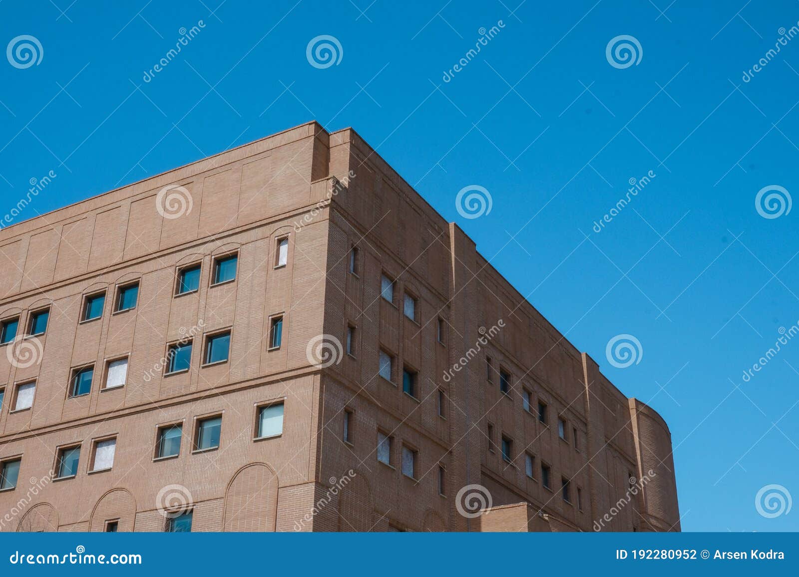 Generic Red Brick Office Building with Perfect Blue Skies in the ...