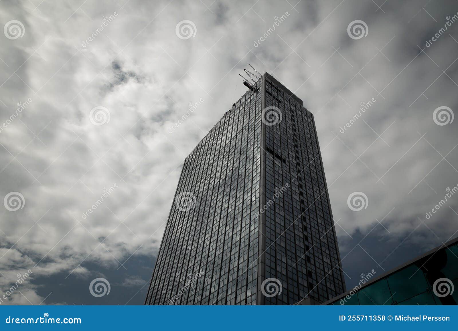Generic Skyscraper with Glass Facade in Front of Dramatic Sky with ...