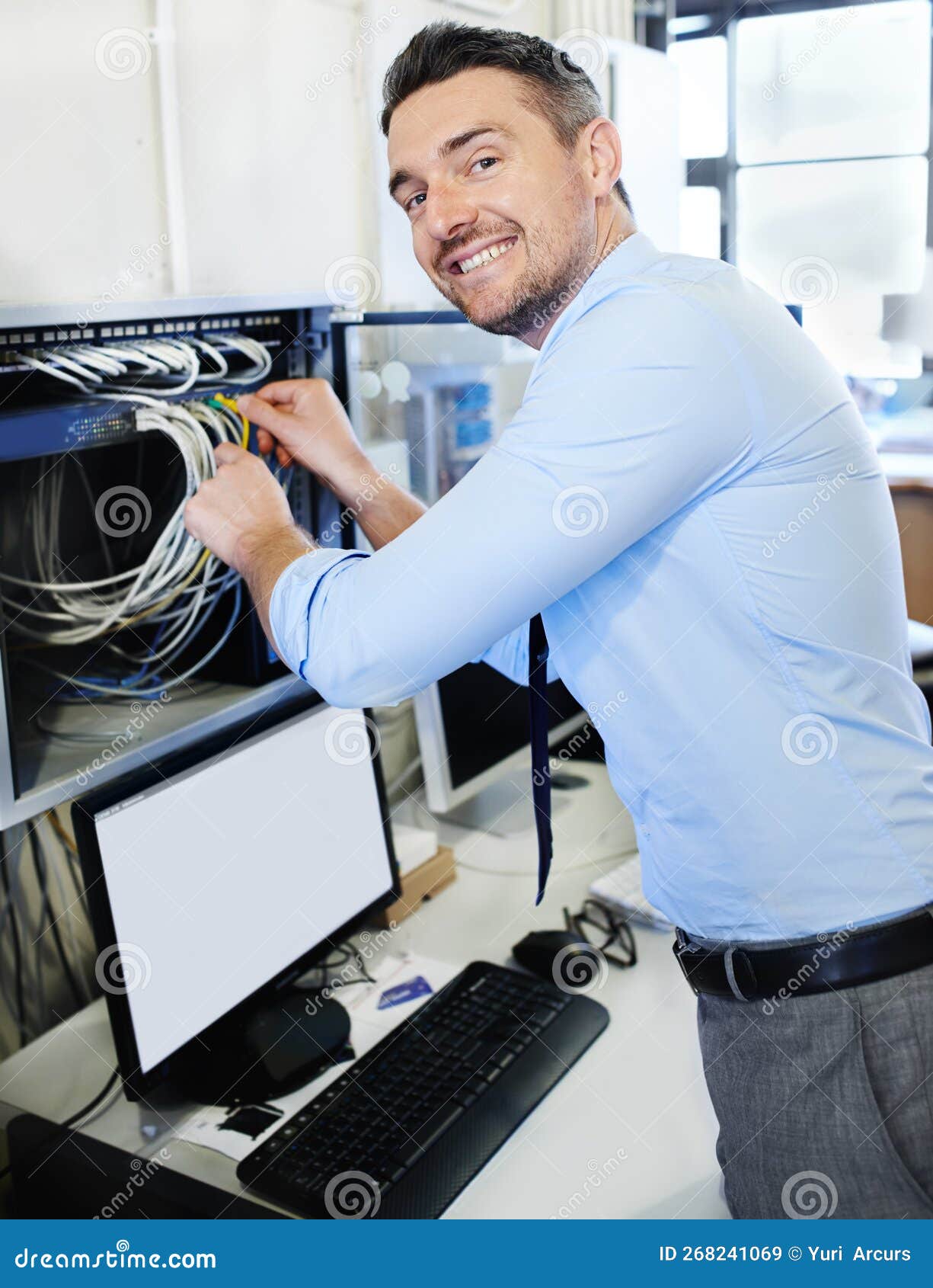 The Genius Behind the Company. Portrait of a Smiling Computer Engineer ...