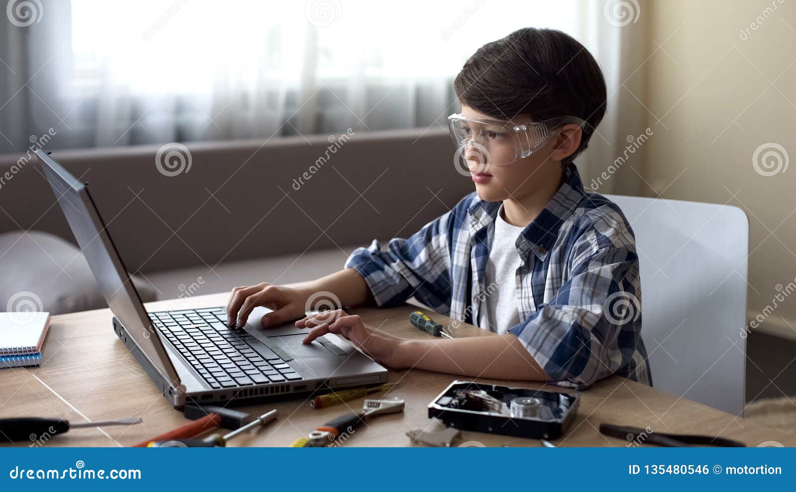 Genius Child in Safety Glasses Searching Online Instructions To PC ... Genius Child in Safety Glasses Searching Online Instructions To PC ...