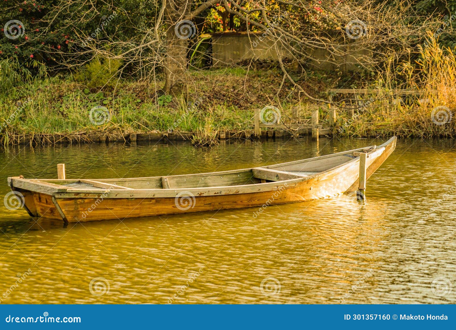 A gentle river wooden boat stock photo. Image of relaxation - 301357160