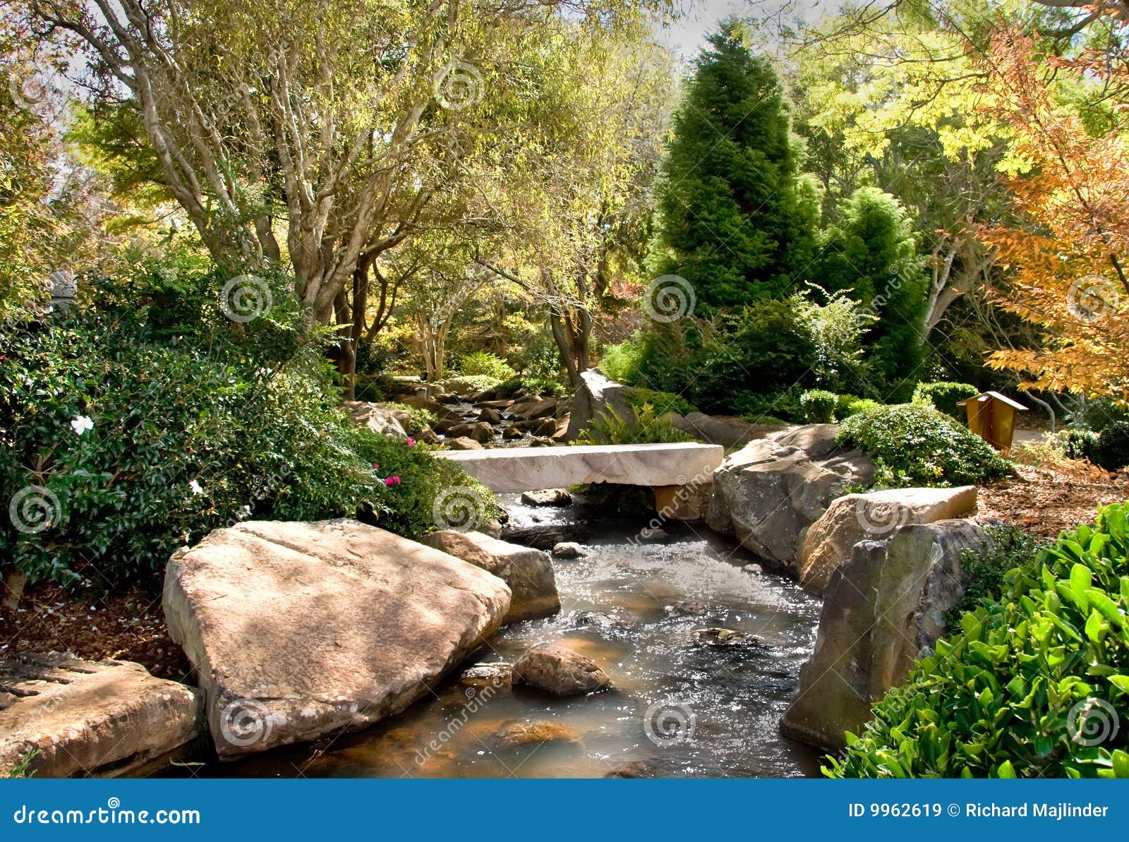Gentle Stream with Stone Bridge Stock Image - Image of stone, flowers ...