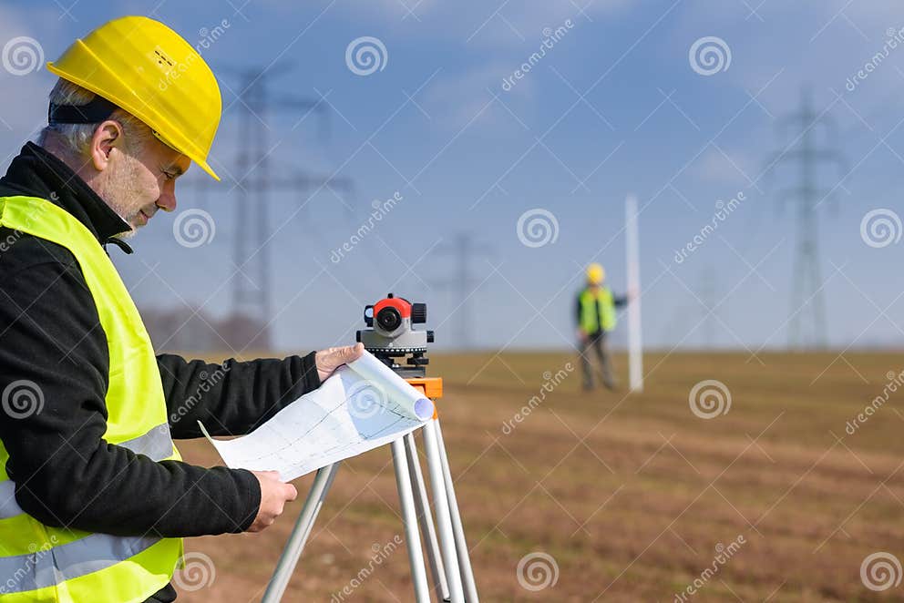 Geodesist Measure Land on Construction Site Stock Photo - Image of male ...