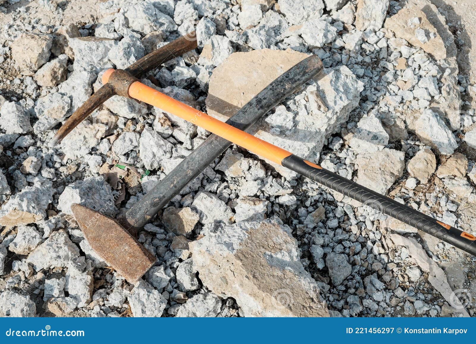 Geological Pick with Orange Handle on the Stones Next To Old Hammer ...