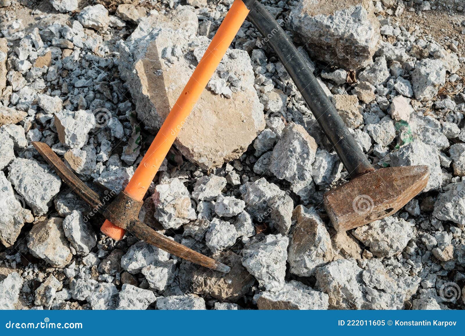 Geological Pick with Orange Handle on the Stones Next To Old Hammer ...