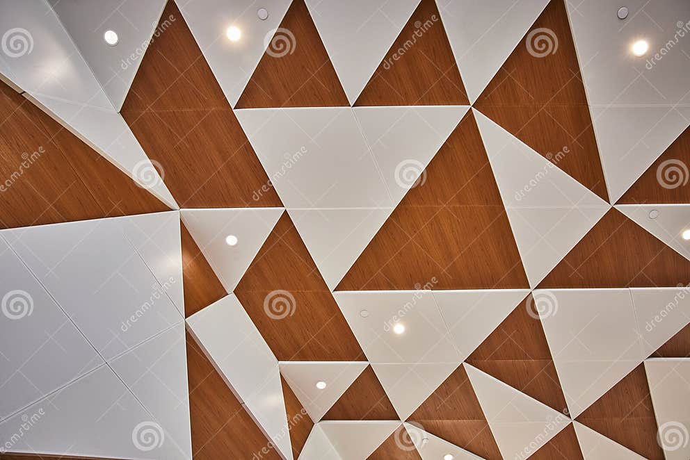 Geometric Ceiling Design with Triangular Panels and Recessed Lighting ...