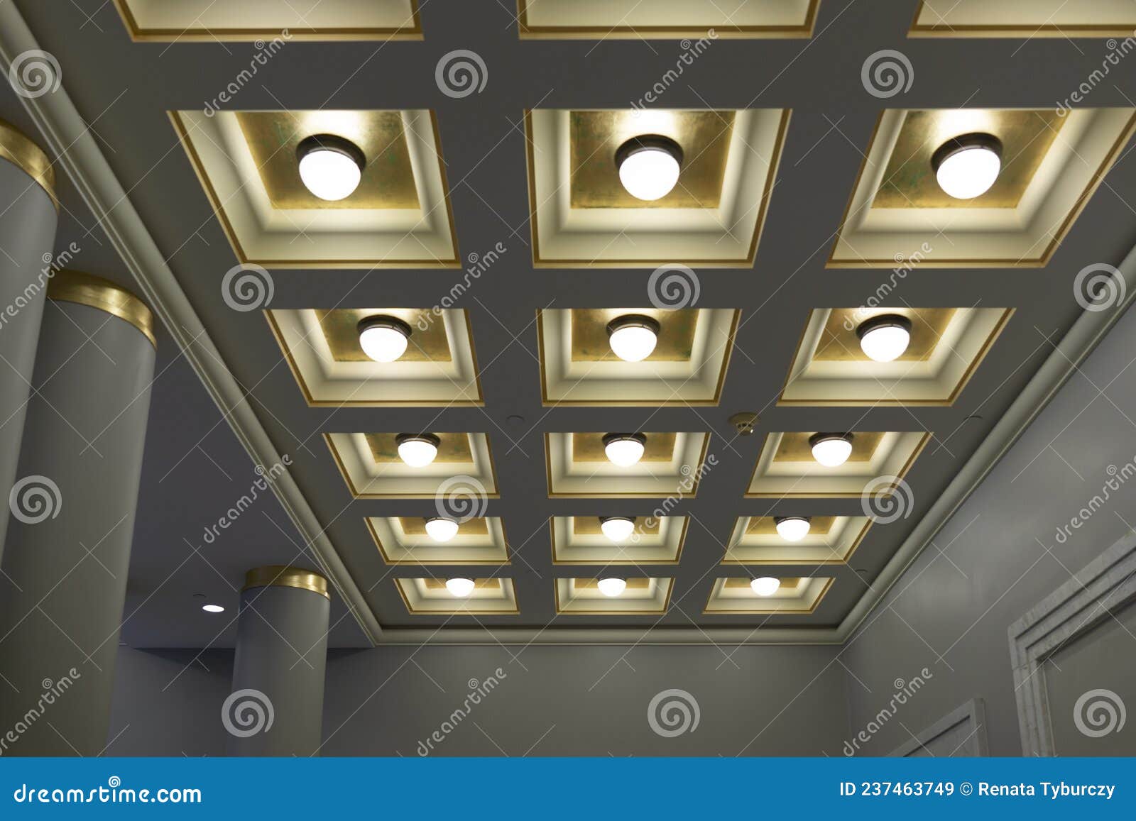 Geometric Ceiling with Square Boxes and Round Lamps in a Row and Column ...
