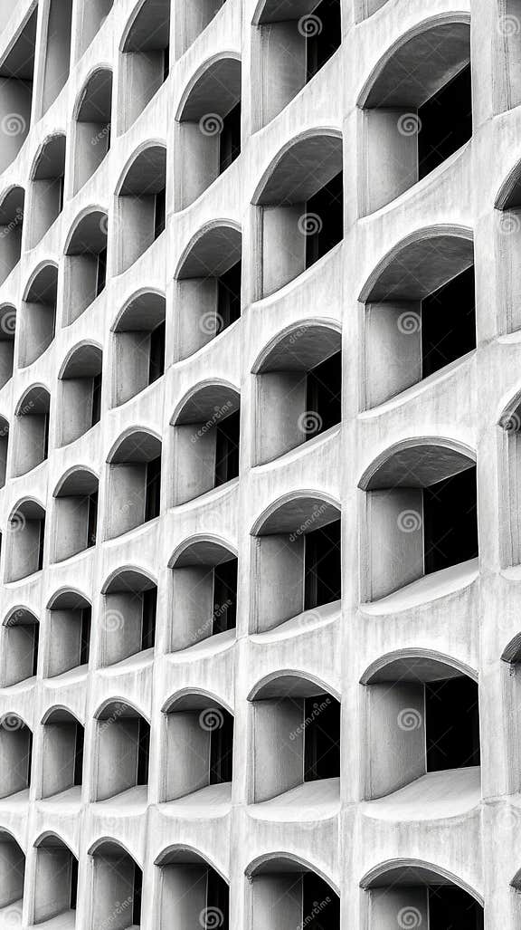 Geometric Facade with Repetitive Arched Patterns Creates a Striking ...