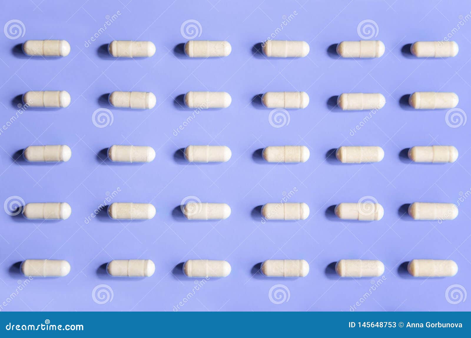 Geometric Pattern of White Vitamins in Capsules on Light Blue ...