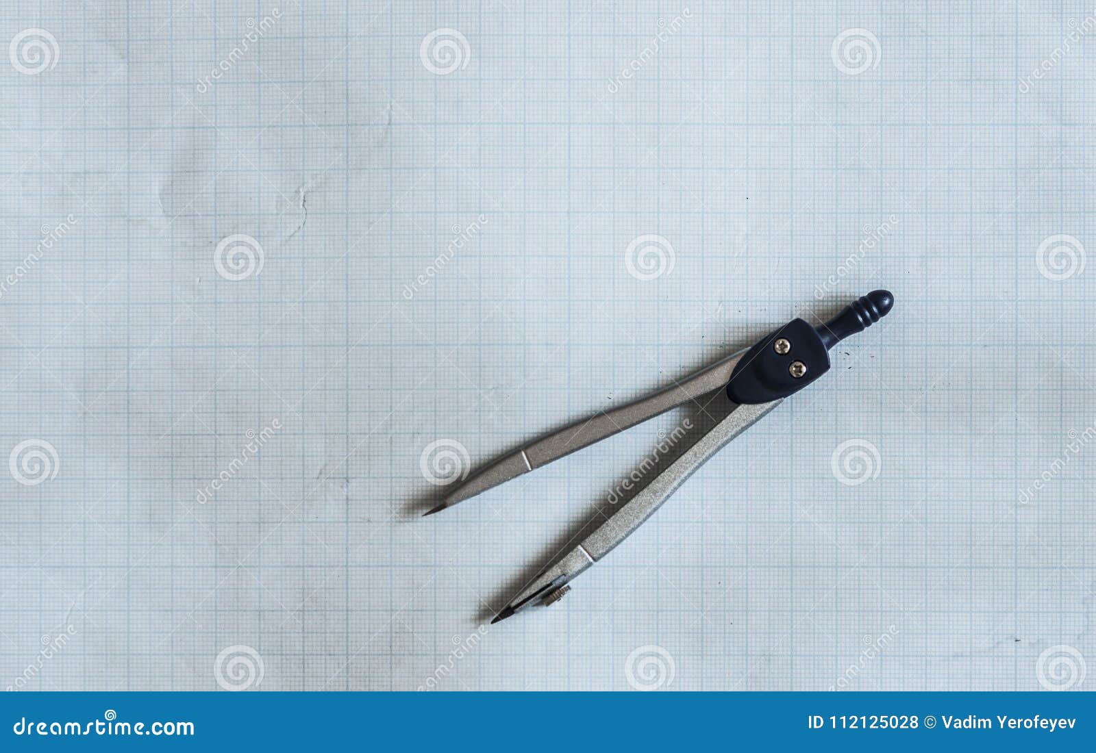 Pencil, Compass and Rulers on Graph Paper Background Stock Photo ...
