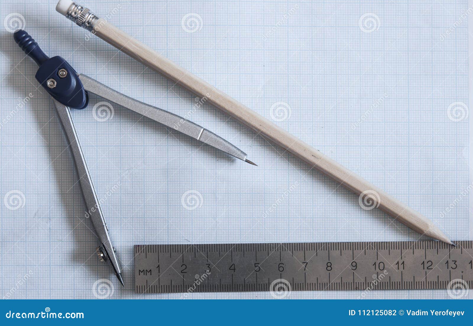 Pencil, Compass and Rulers on Graph Paper Background Stock Photo ...