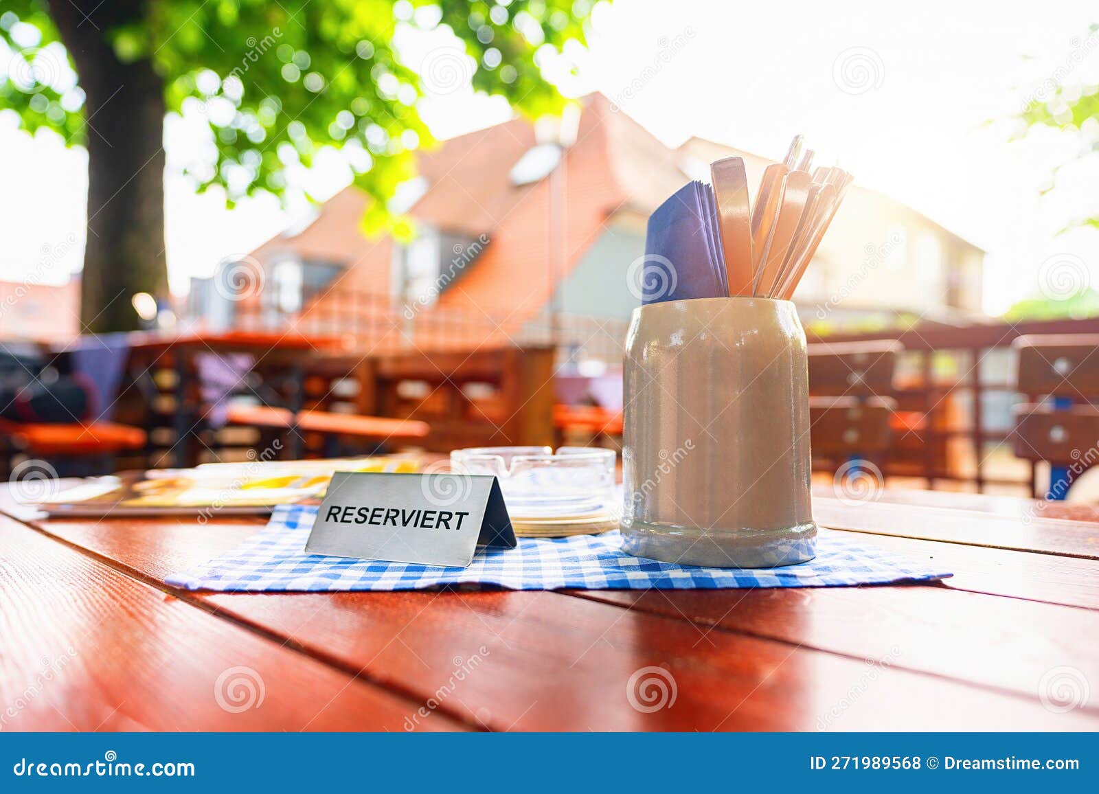 German Beer Garden Table with Reserved Table Sign with Places Setting ...