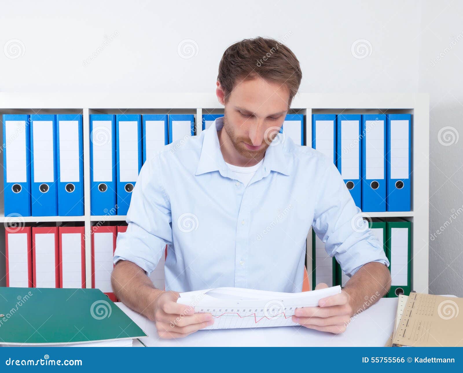 German Businessman Reading Documents at Office Stock Photo - Image of ...