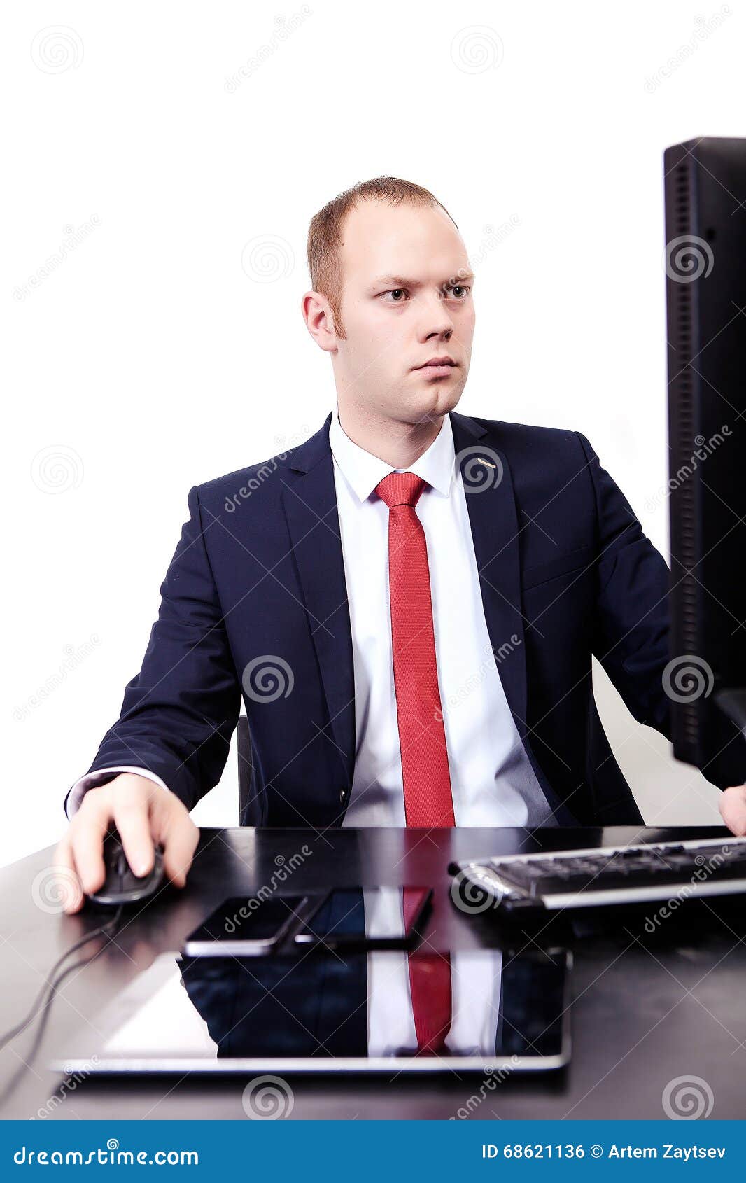 German Businessman Working in the Workplace Computer. Phone, Tablet ... German Businessman Working in the Workplace Computer. Phone, Tablet ...