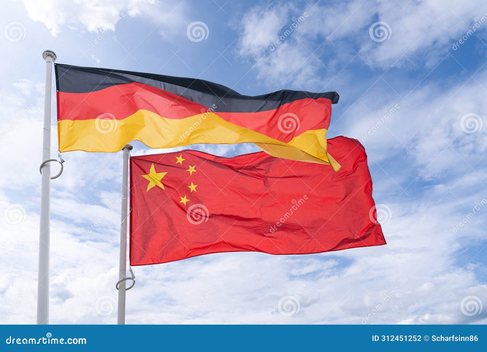 German and Chinese Flags Flutter in the Wind Stock Photo - Image of ...