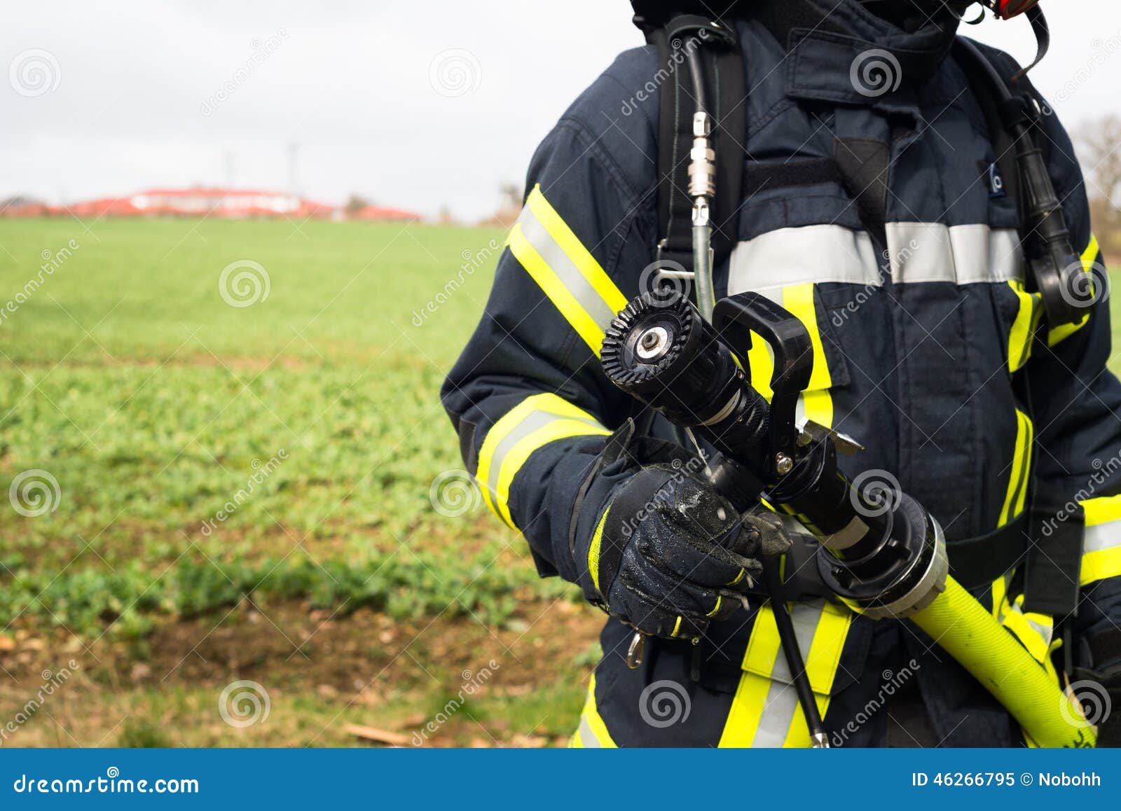 German Firefighter with Water Hose in Action Stock Image - Image of ...