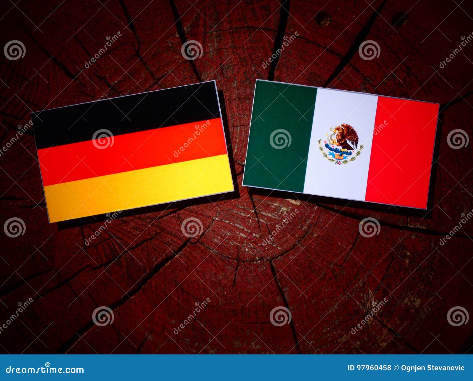 German Flag with Mexican Flag on a Tree Stump Isolated Stock Photo ...