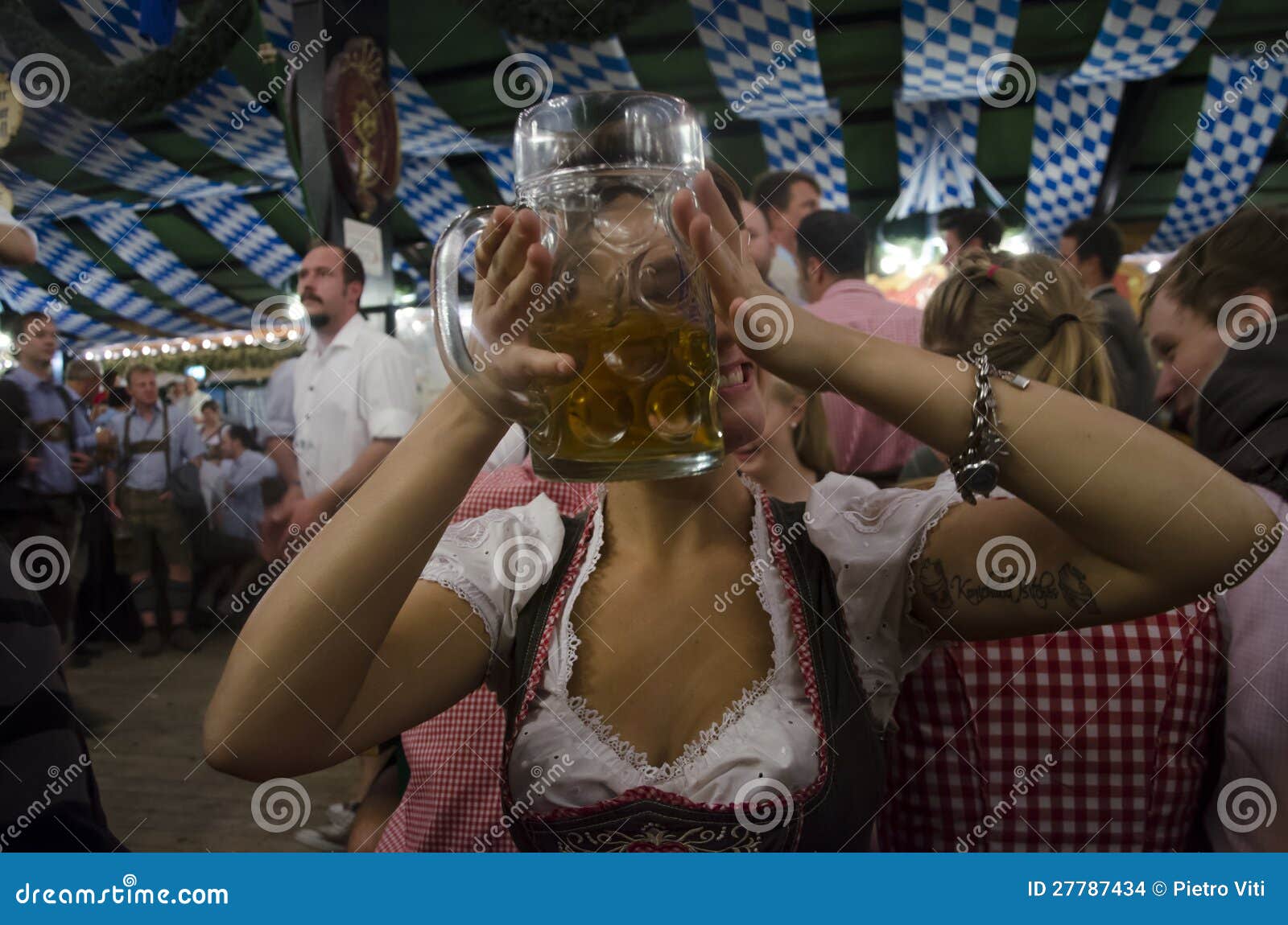 German Girl Drinking During Oktoberfest 2012 Editorial Stock Image