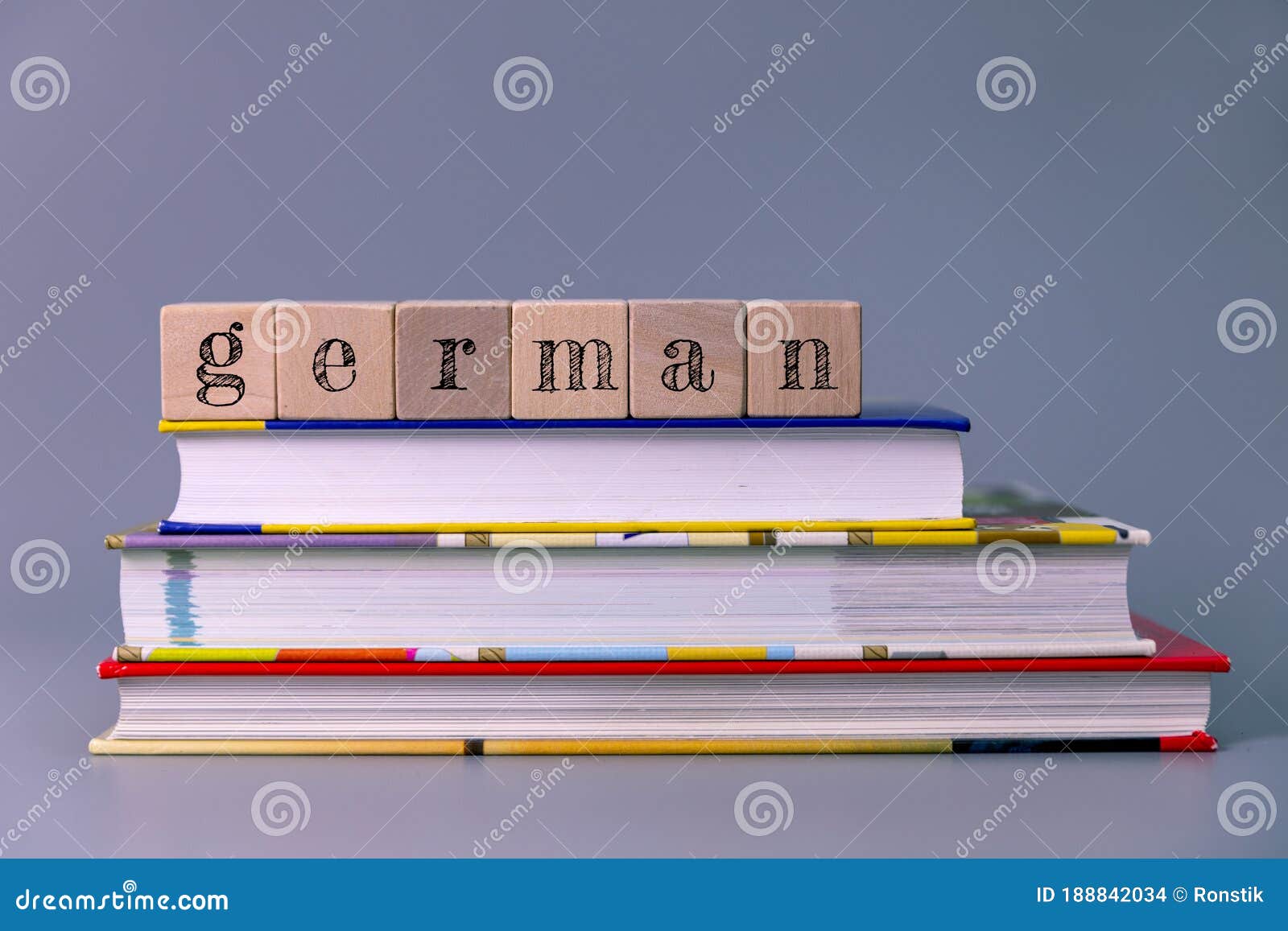 German Language Course and Learning Concept. Stack of Books with Wooden ...