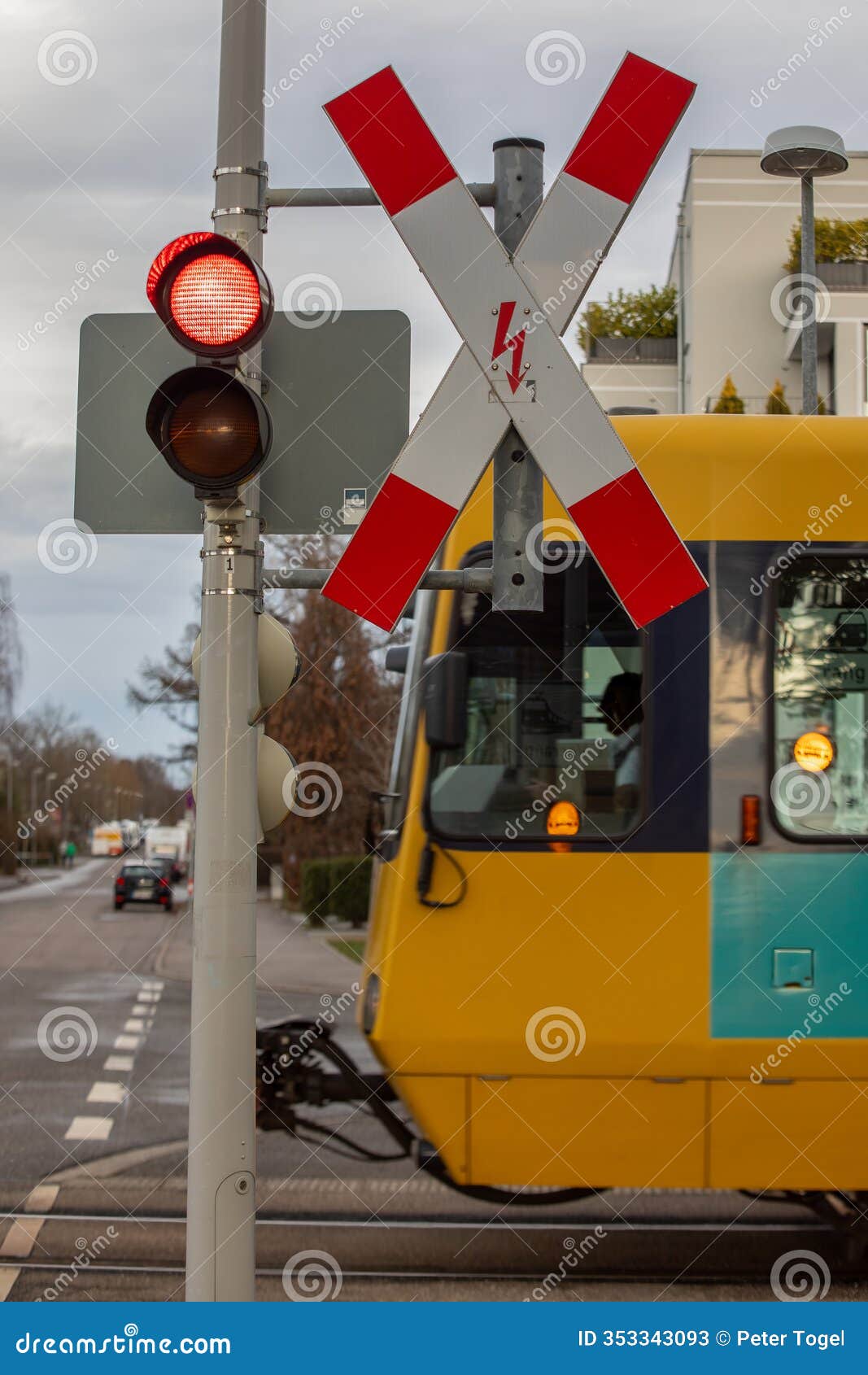 German Light Rail Train Crossing a Road with Red Light and Crossing ...
