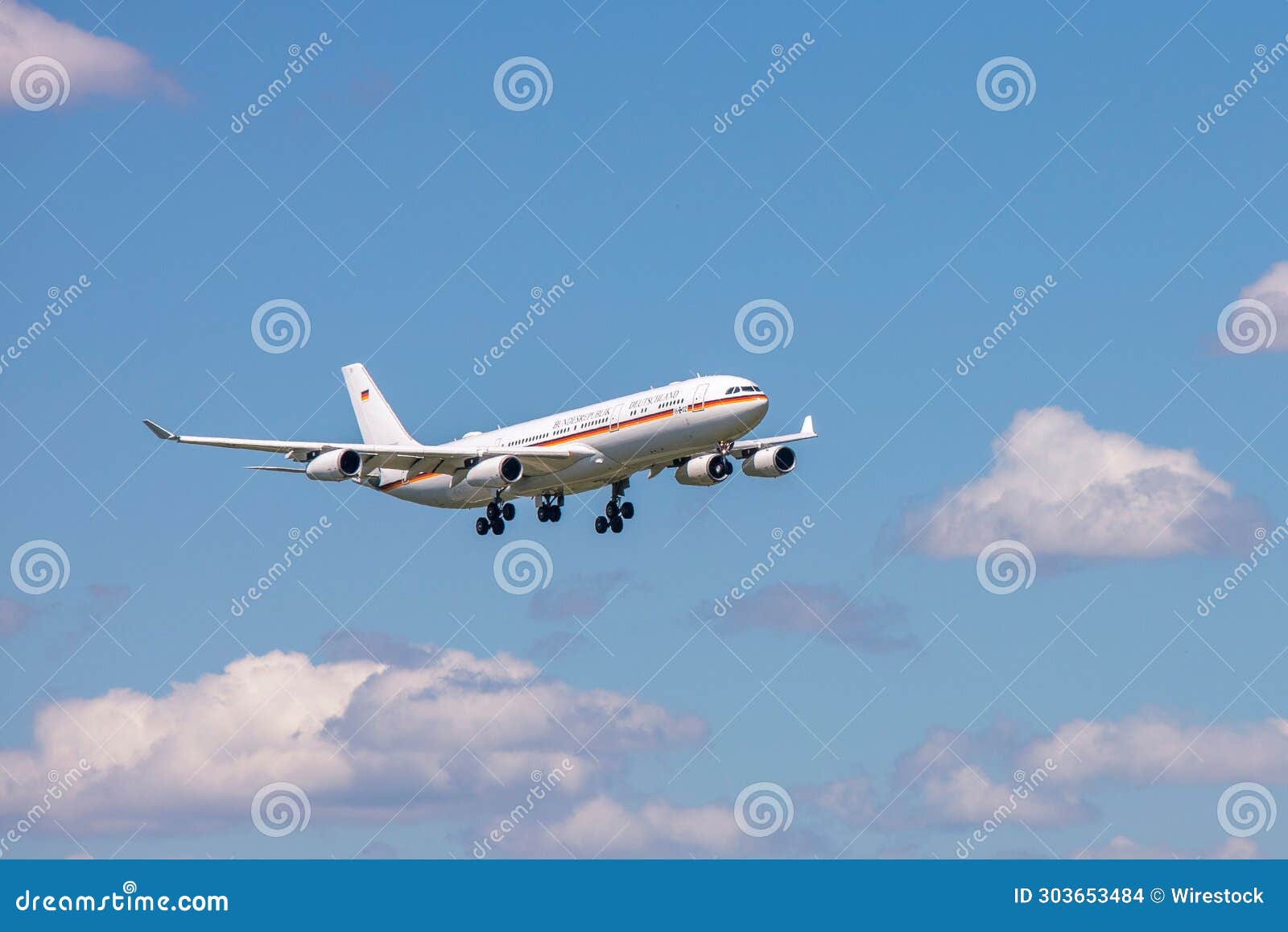 German Plane Flying High Above Clouds in the Blue Sky Editorial Stock ...