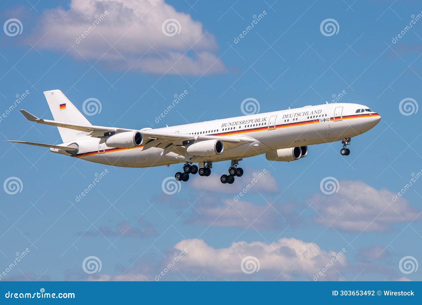 German Plane Flying High Above Clouds in the Blue Sky Editorial ...