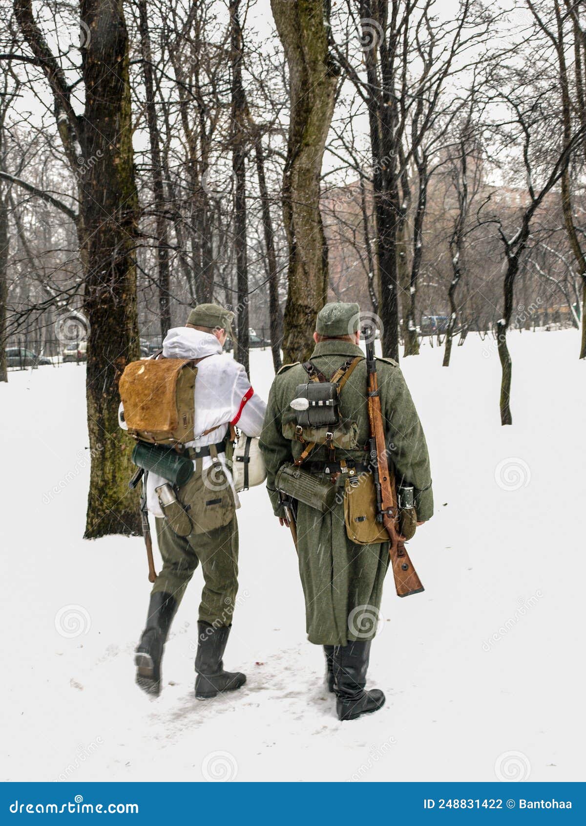 German Soldiers of World War II in a Snowy Forest, View from the Back ...