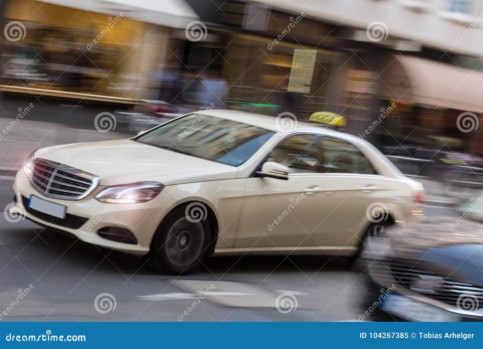 German Taxi Cab Speeding in the City Stock Image - Image of blur, sign ...
