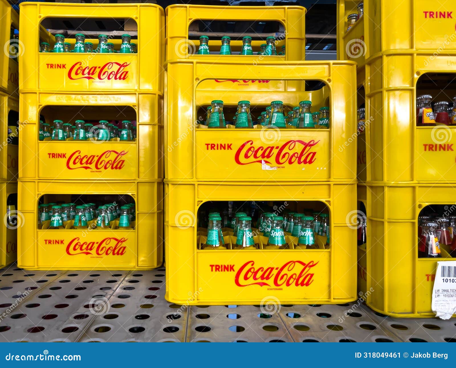 Germany Berlin May 11, 2024. a Stack of Yellow Coca-Cola Crates ...