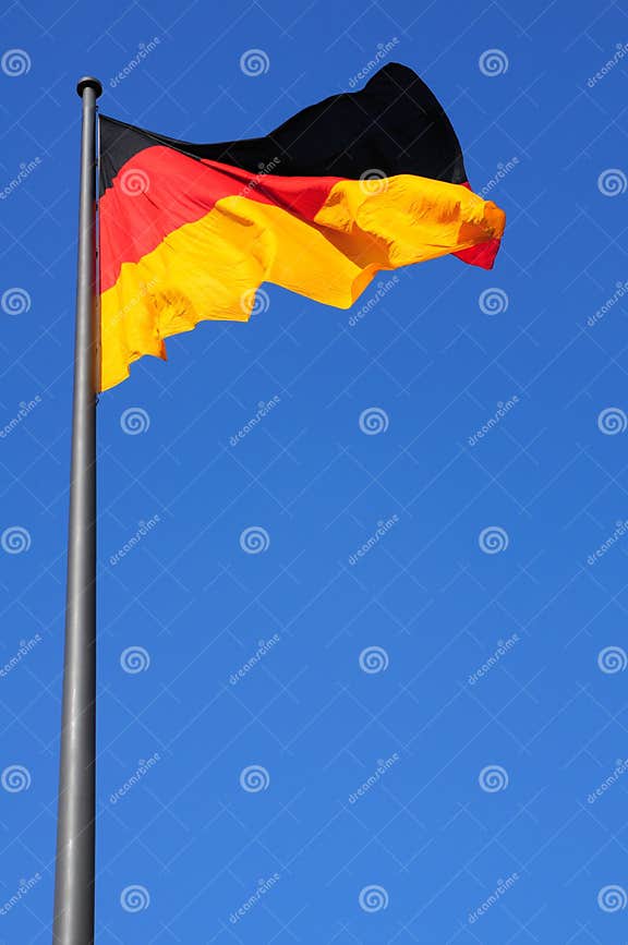 Germany flag in a blue sky stock image. Image of cooperation - 5110789