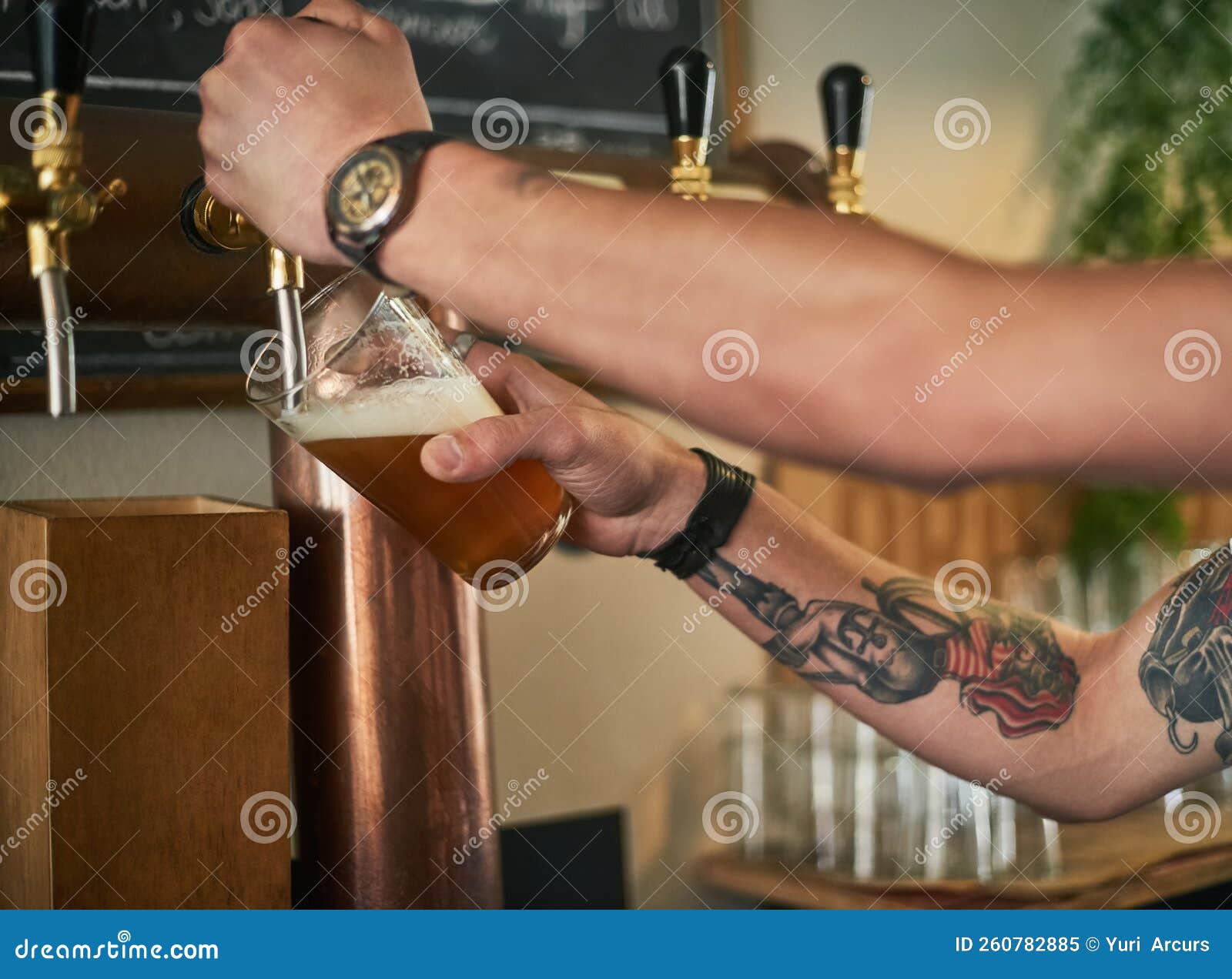 Get it while Its Cold. an Unidentifiable Young Bartender Pouring Beer ...