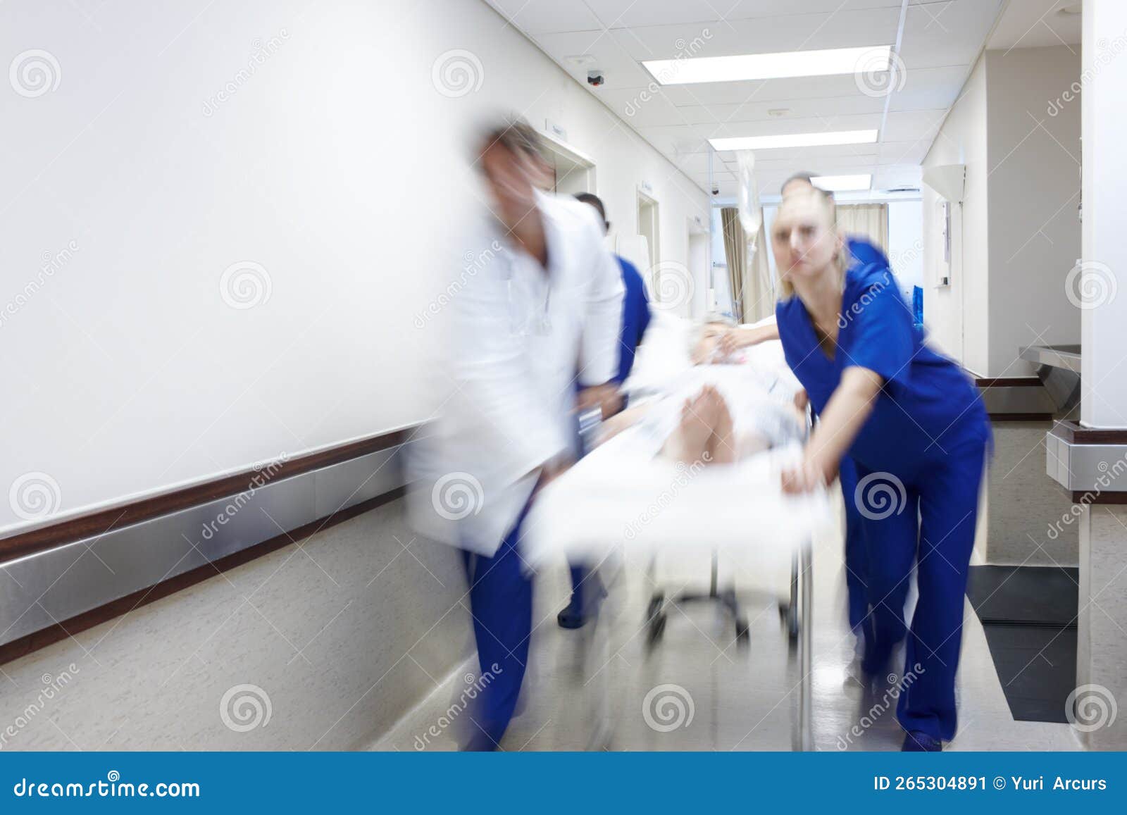 Get the or Ready, Now. a Group of Doctors Rushing a Patient Down the ...