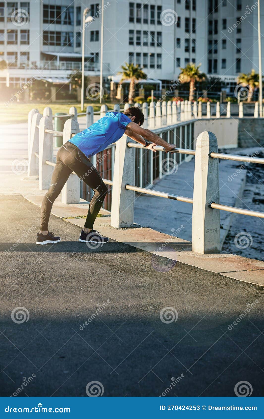 Get Ready To Get in Shape. a Young Man Stretching Outside before His ...