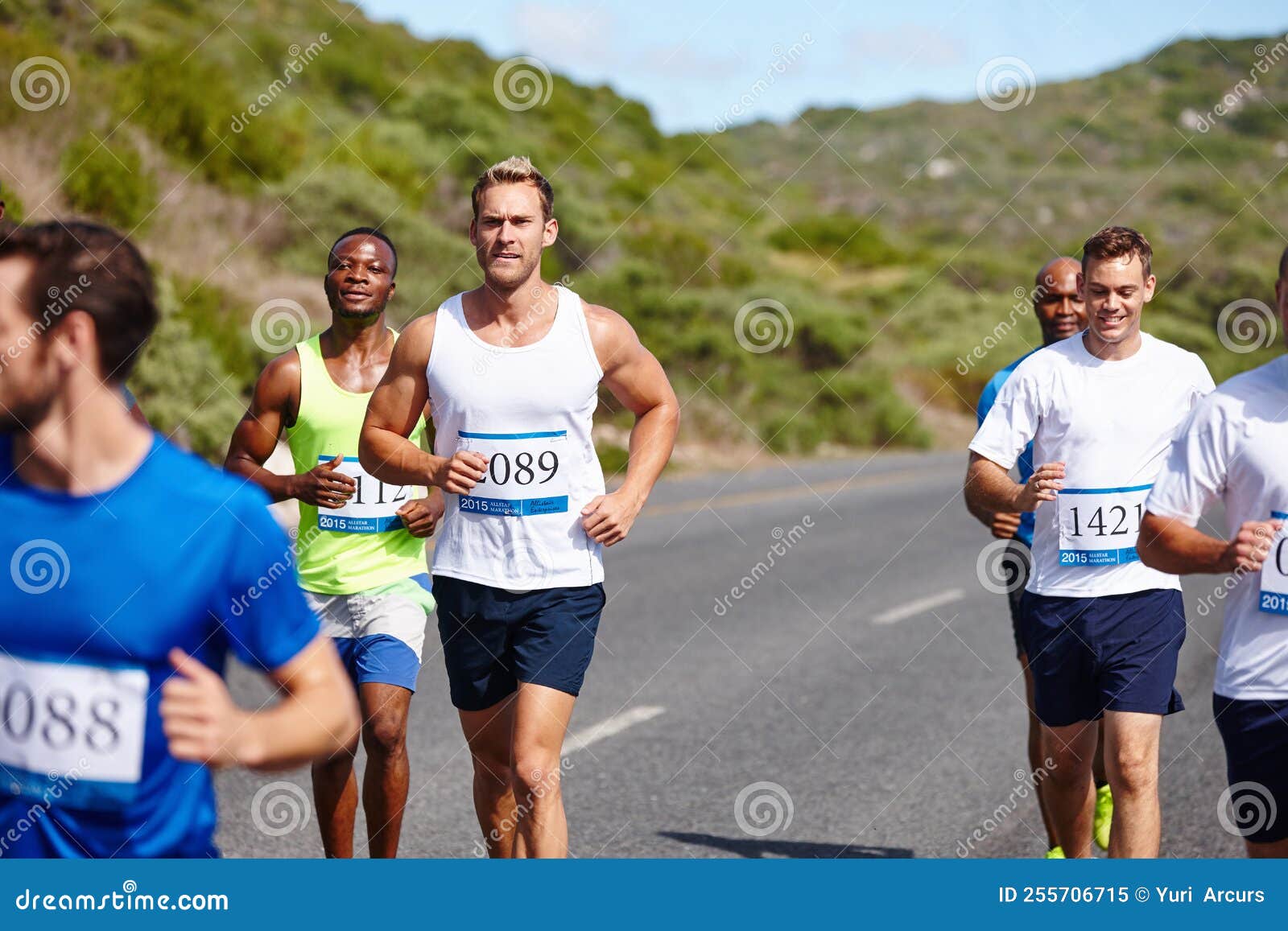 Get Your Blood Pumping... Run a Marathon. a Group of Young Men Running a Marathon. Stock Image ...