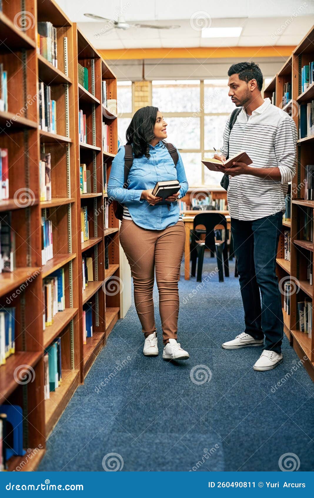 Getting All the Books they Need Around the Library. Two University ...