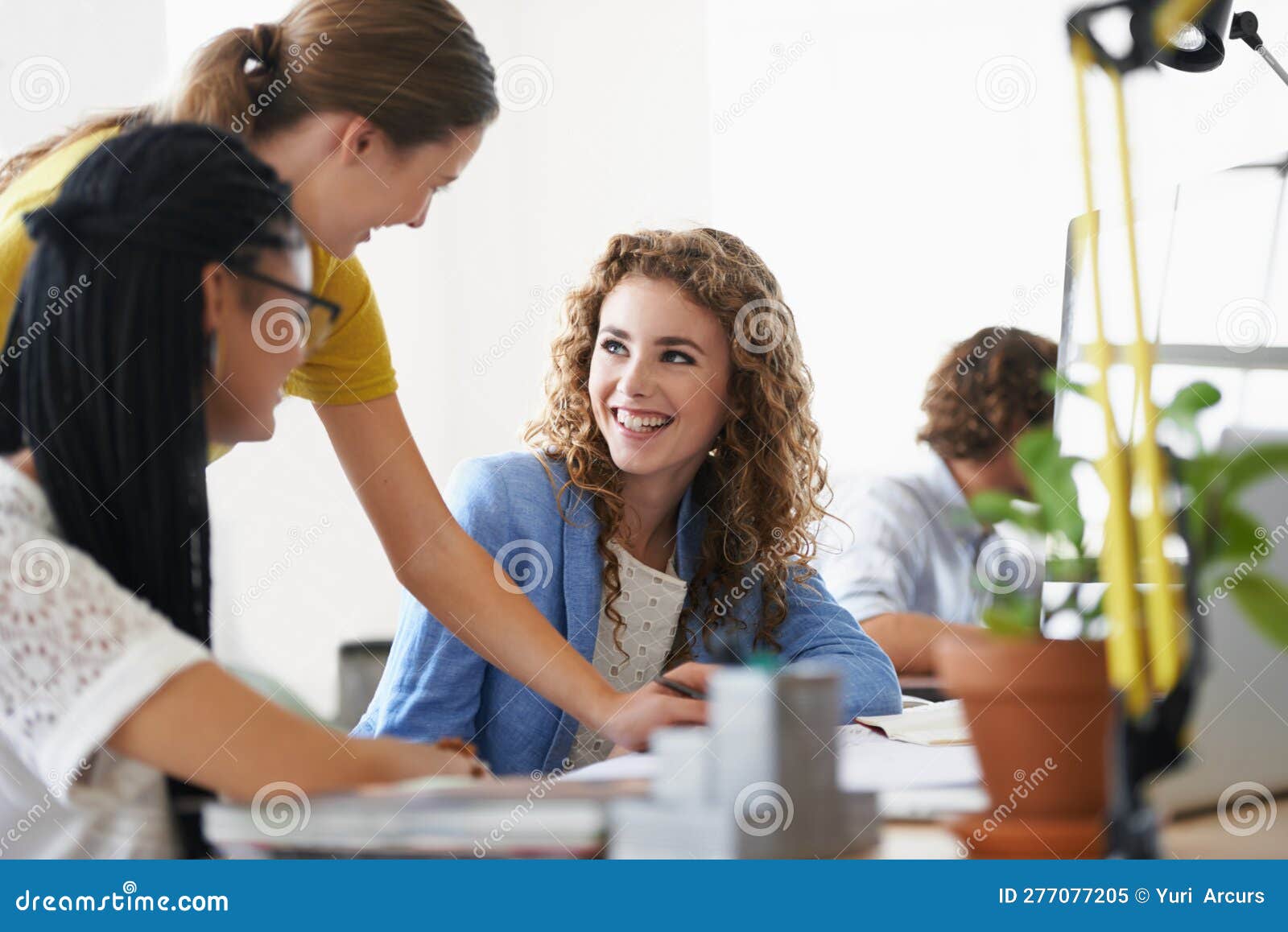 Getting a Bit of Friendly Guidance. a Group of Young Coworkers Talking ...