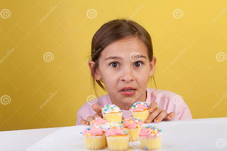 Getting Caught Stealing Cupcakes Stock Image - Image of brunette ...