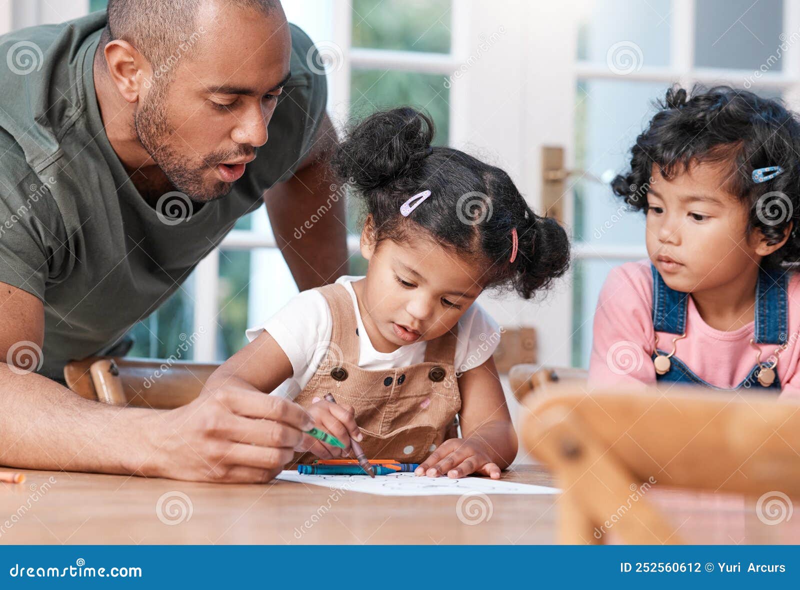 Getting Creative is Tons of Fun. a Father Colouring in a Picture with ...