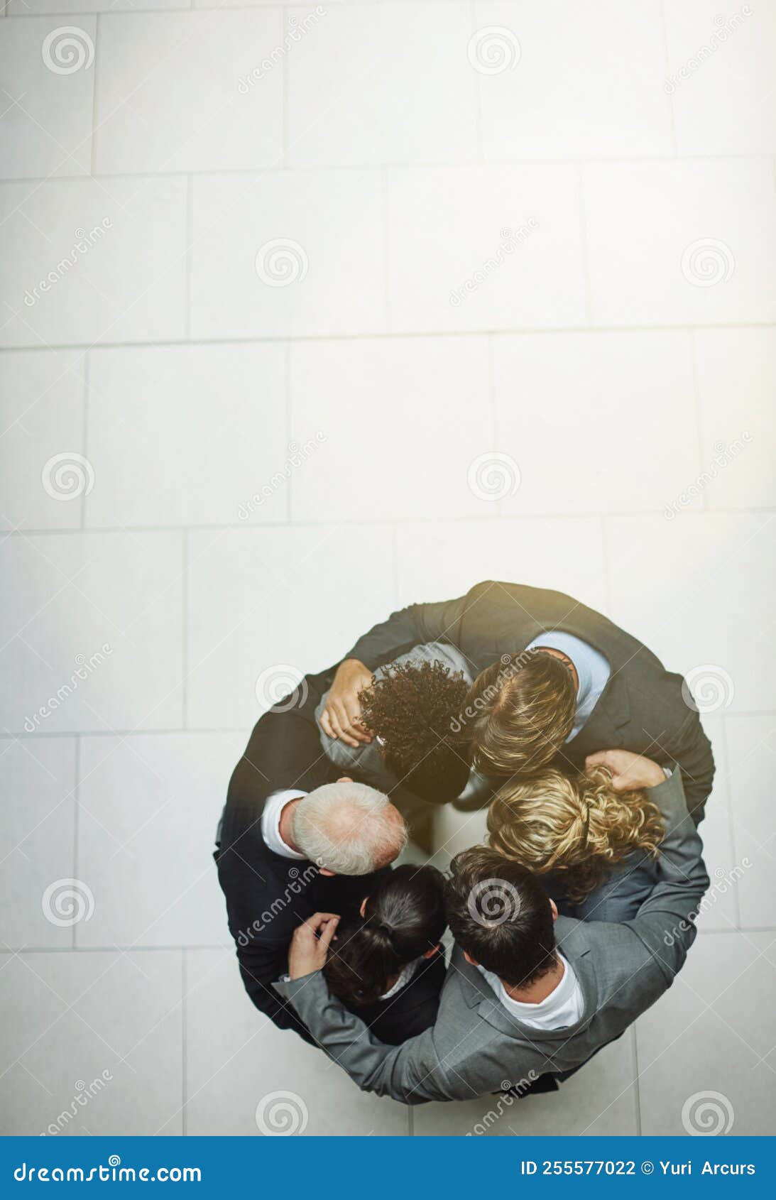 Getting the Day Started with a Huddle. High Angle Shot of a Group of ...