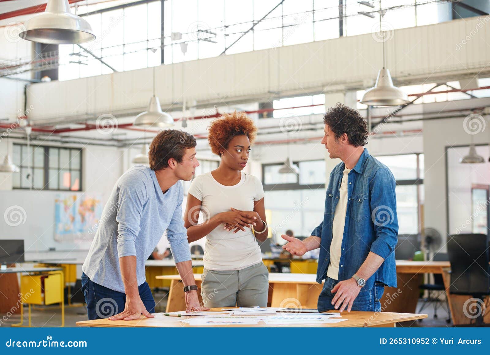 Getting into the Details. a Group of Colleagues Collaborating with Each ...