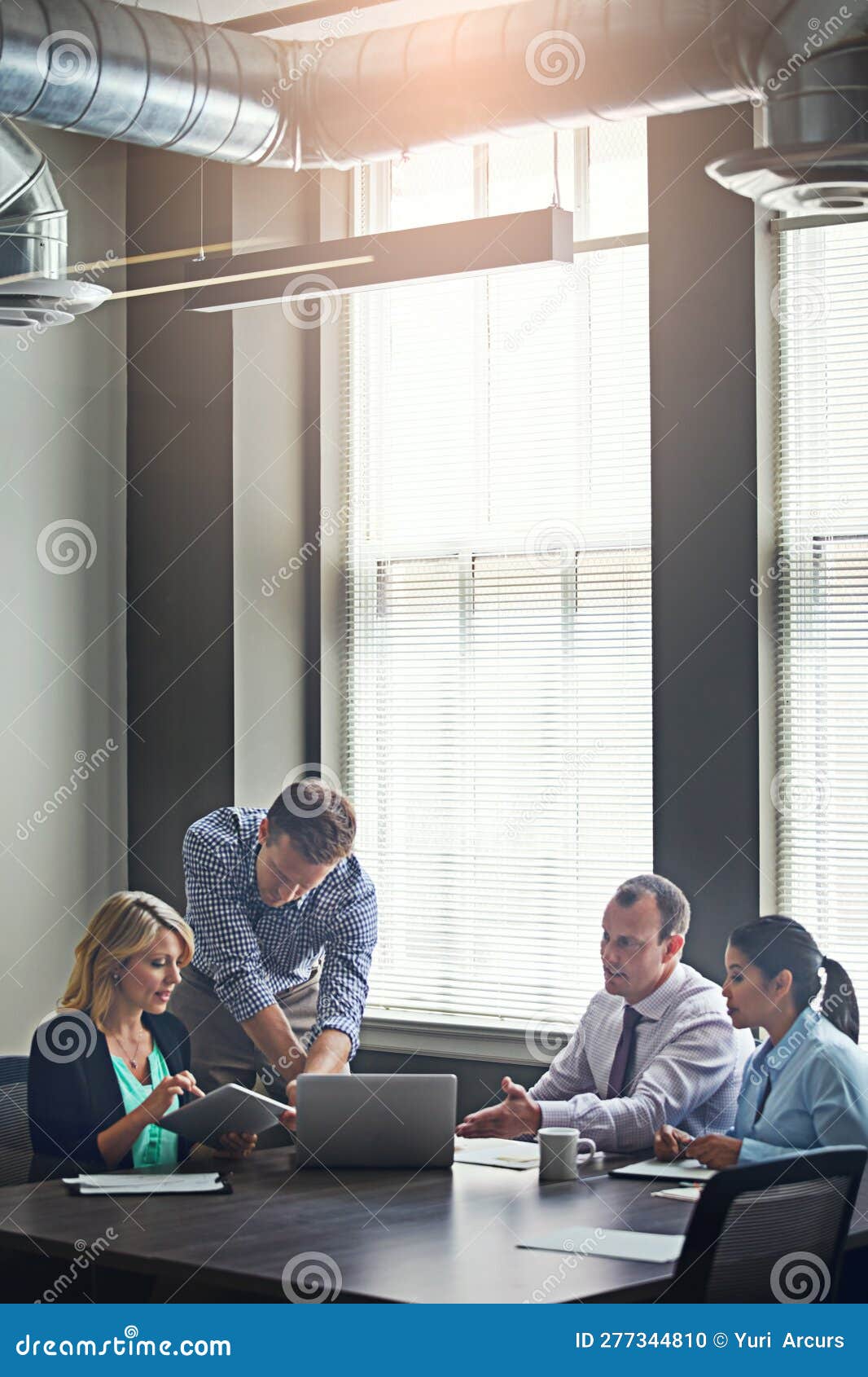 Getting it Done As a Unit. a Group of Colleagues Having a Meeting in ...